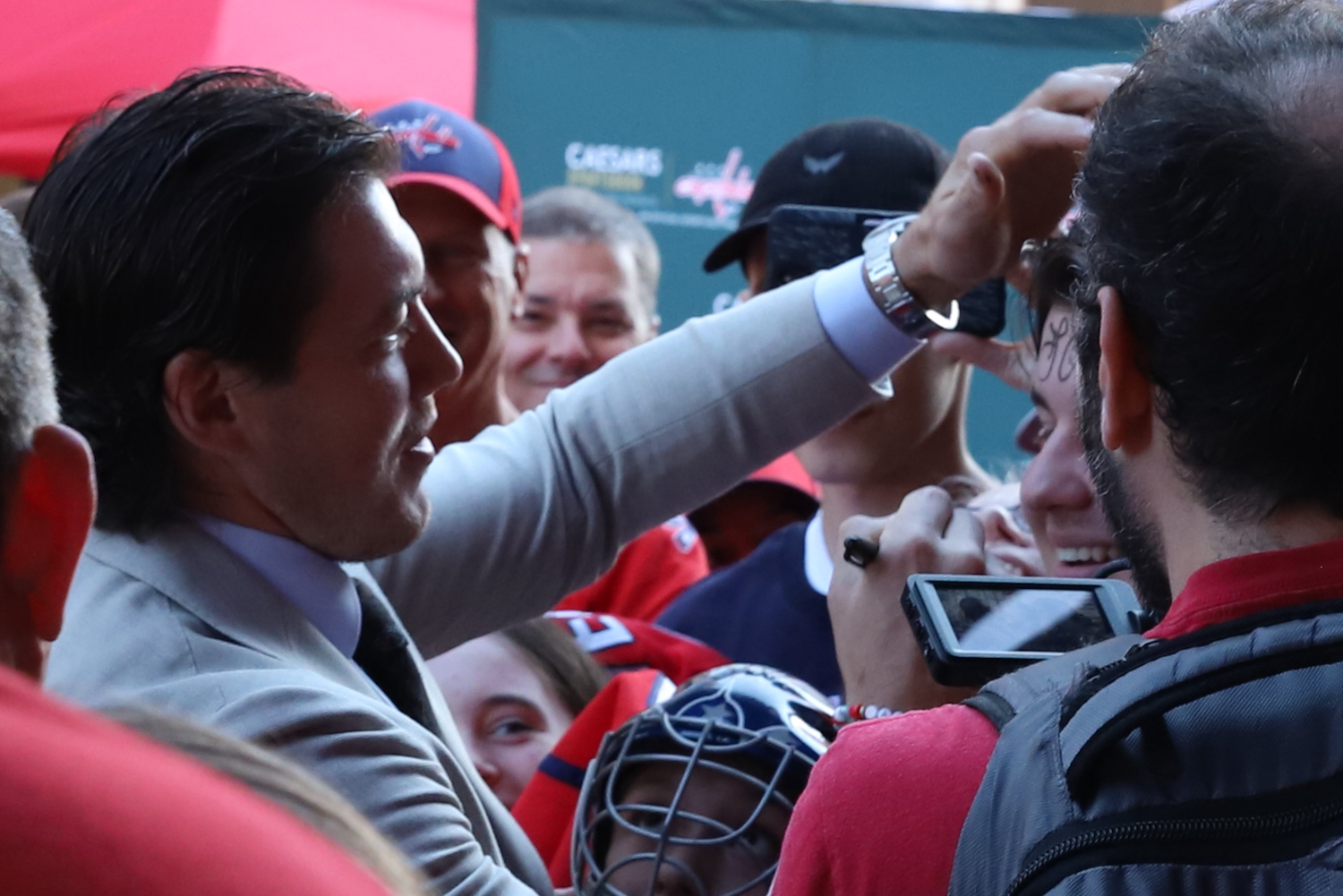 T.J. Oshie Signs a Fan's Forehead